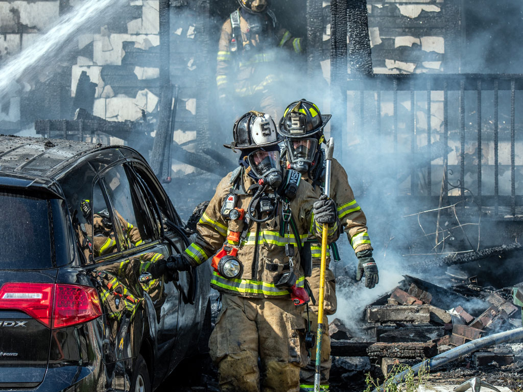 Intense fire burns in Manchester at same location a firefighter and two ...